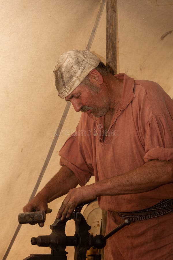 1800`s Blacksmith Using a Vice and a Hammer Stock Image - Image of hand ...