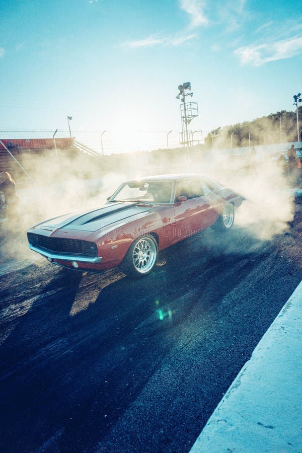 A dragster doing a burnout stock photo. Image of drag - 105453838