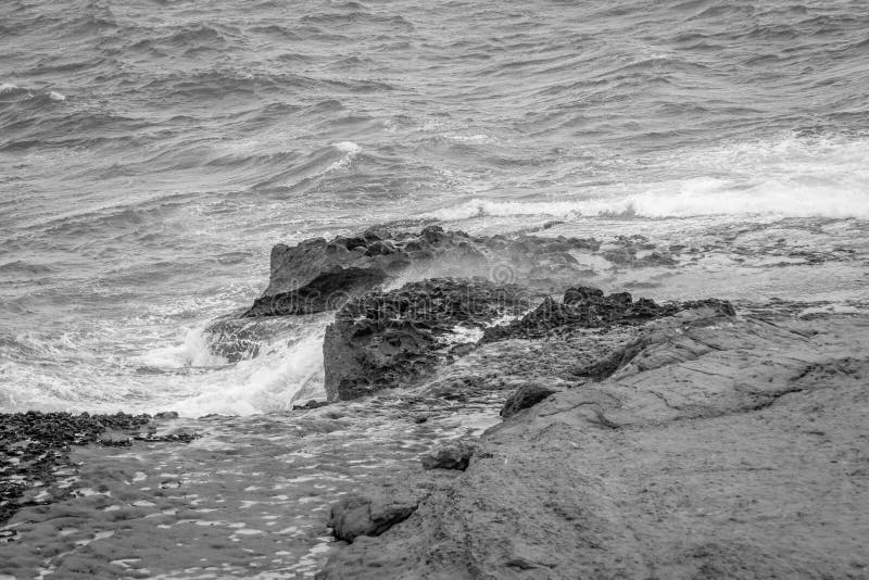 Saaidia Island and Waves and Rocks Stock Photo - Image of locations ...