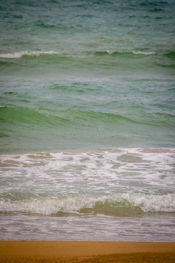 Saaidia Beach and Waves and Rocks Stock Image - Image of green, chair ...