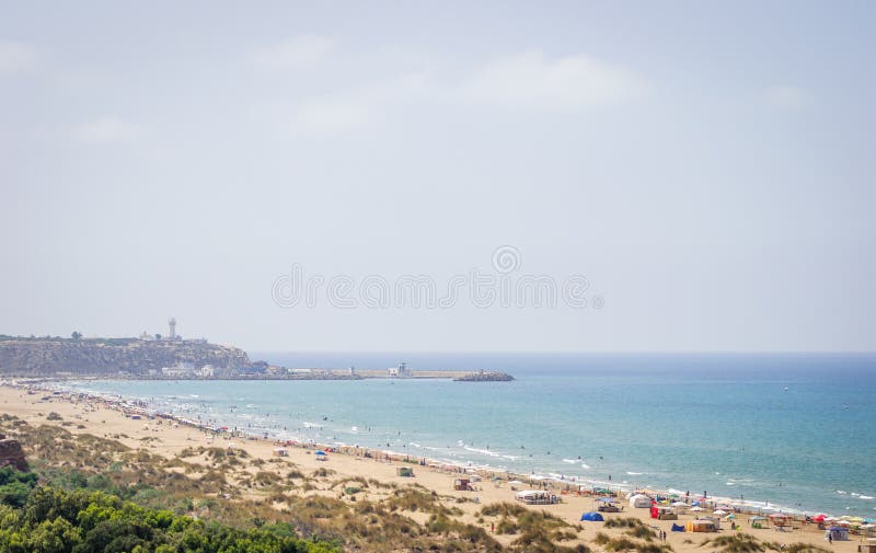 Saaidia Beach and Waves and Rocks Stock Photo - Image of 7wade, green ...