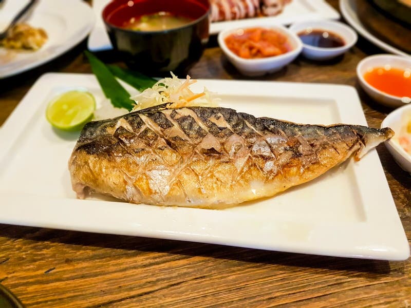 Saba fish grilled. stock photo. Image of sliced, lemon - 100345690