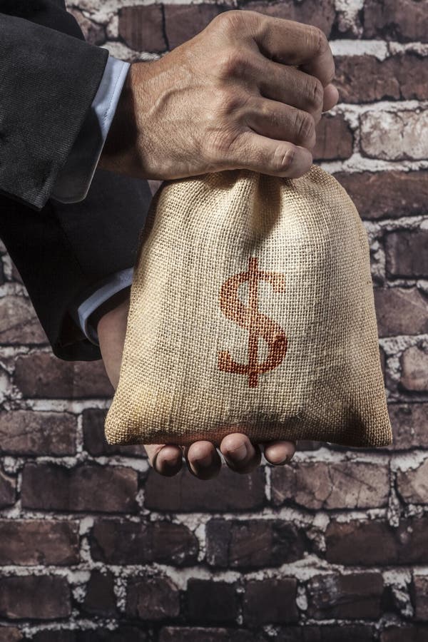 Geld-Sack in der Hand stockfoto. Bild von moneybag, wirtschaftlichkeit ...