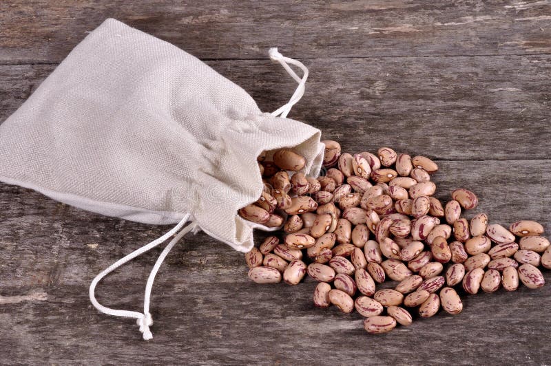 Sack of Mix Beans Spill Beans with Beans on Wooden Table Stock Photo ...