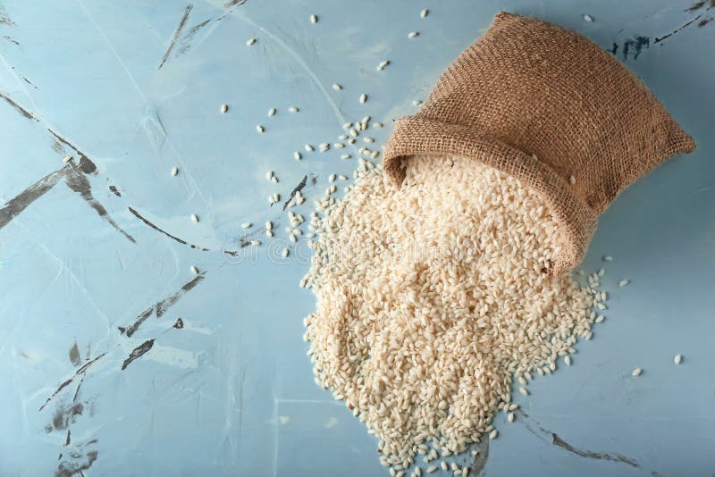Sack with Raw Rice on Table, Top View Stock Photo - Image of scattered ...