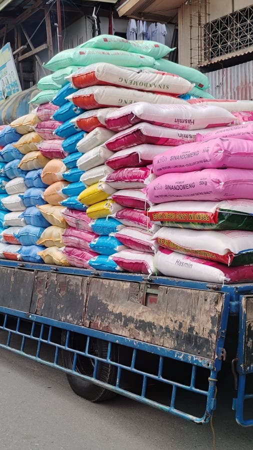 Sacks of Rice Loaded on To a Truck Stock Photo - Image of sacks, loaded ...