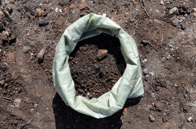 Sacks of soil stock image. Image of white, nature, hands - 92955427