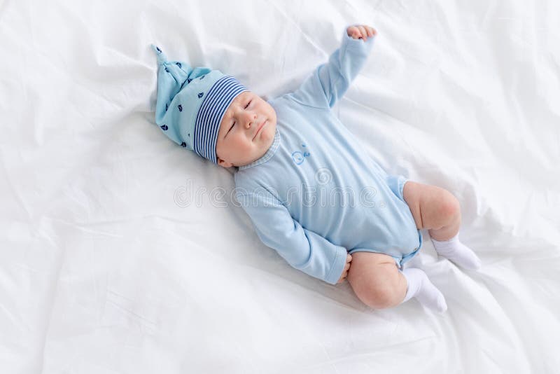 Sad Baby Boy on the Bed Crying Lying on His Back Stock Image - Image of ...
