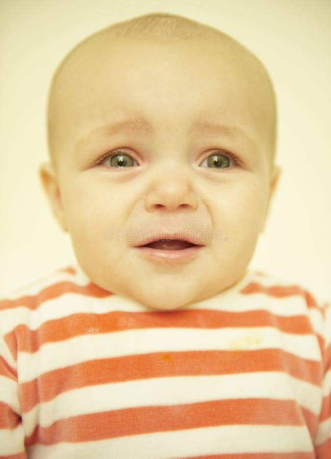 Sad Baby with Striped Shirt Stock Image - Image of caucasian, looking ...
