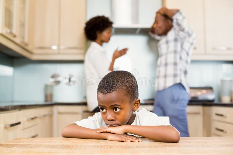 Sad Boy Against Parents Arguing Stock Photo - Image of misery, adult ...