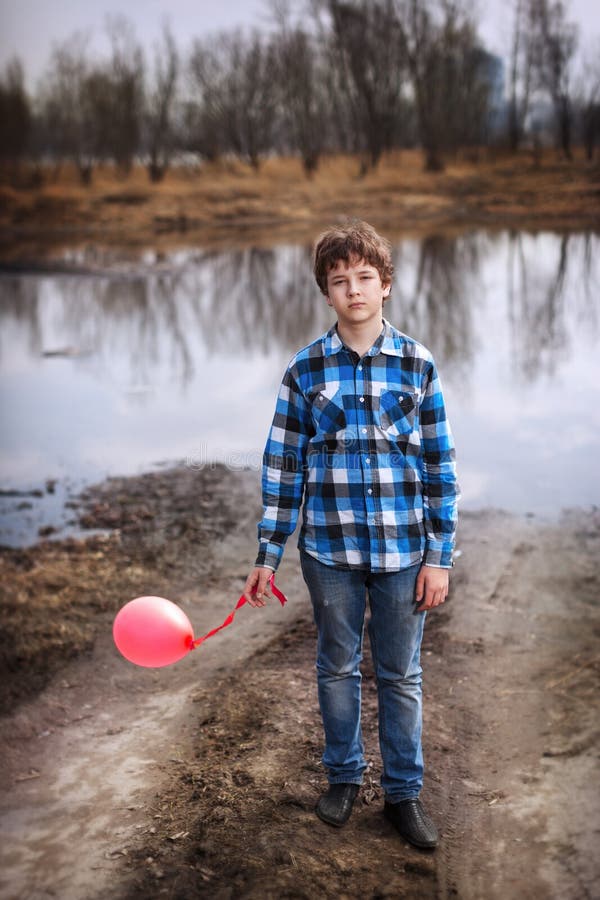 The sad boy with a balloon stock image. Image of outdoors - 30688235