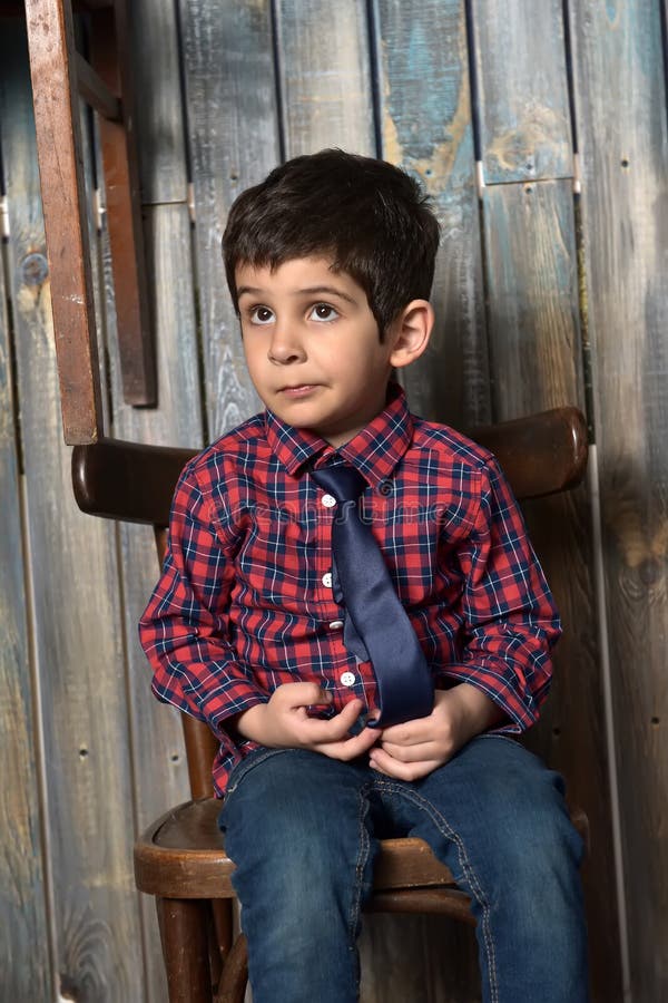 Sad Boy in Checkered Shirt Sitting Stock Image - Image of sill, slender ...