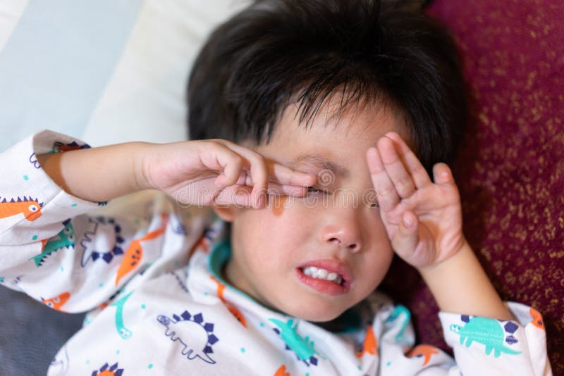 A Sad Boy is Crying, he Doesn`t Want To Go To Bed at Night. Stock Photo ...
