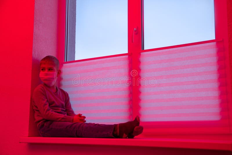 Sad Boy in Danger Sitting on Windowsill in Protective Mask Stock Photo ...