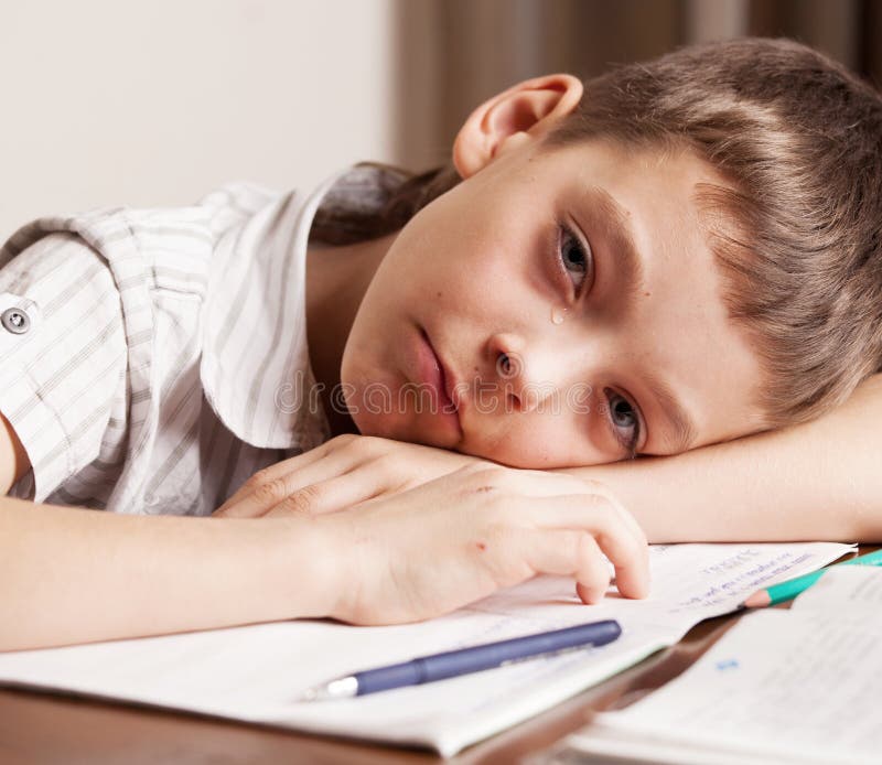 Sad boy doing homework stock photo. Image of problem - 44531744