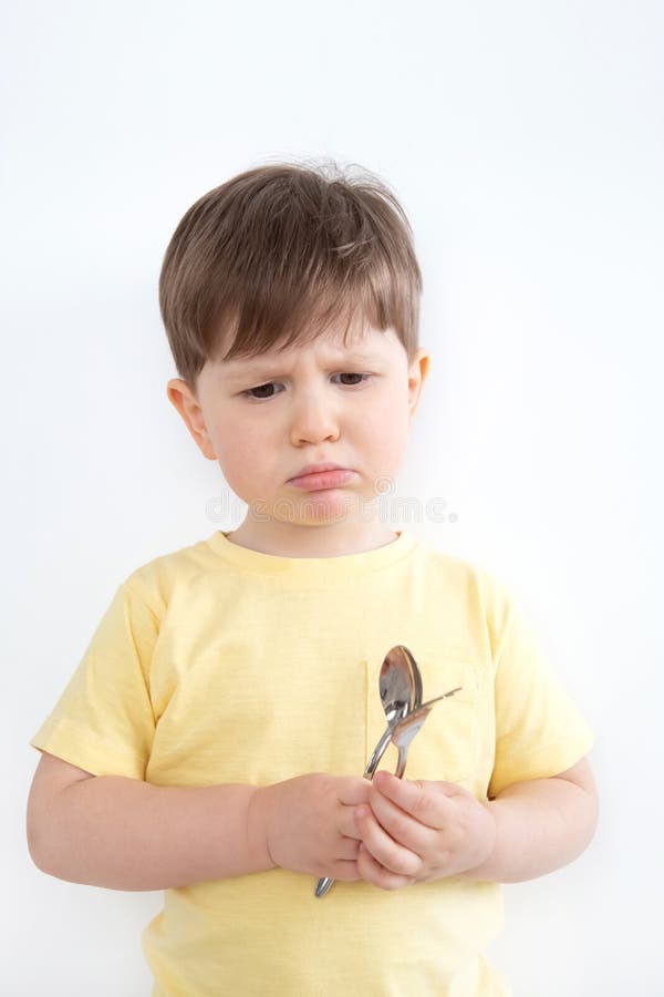Sad Boy Holding a Spoon and a Fork Stock Photo - Image of breakfast ...
