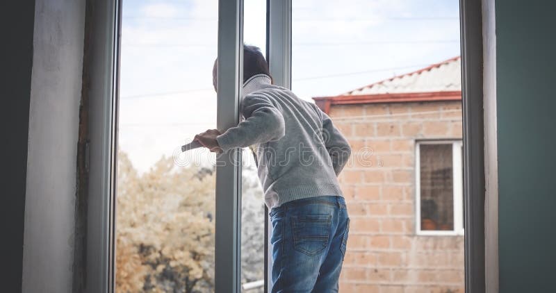 Boy opening the window stock photo. Image of open, barefoot - 25493562
