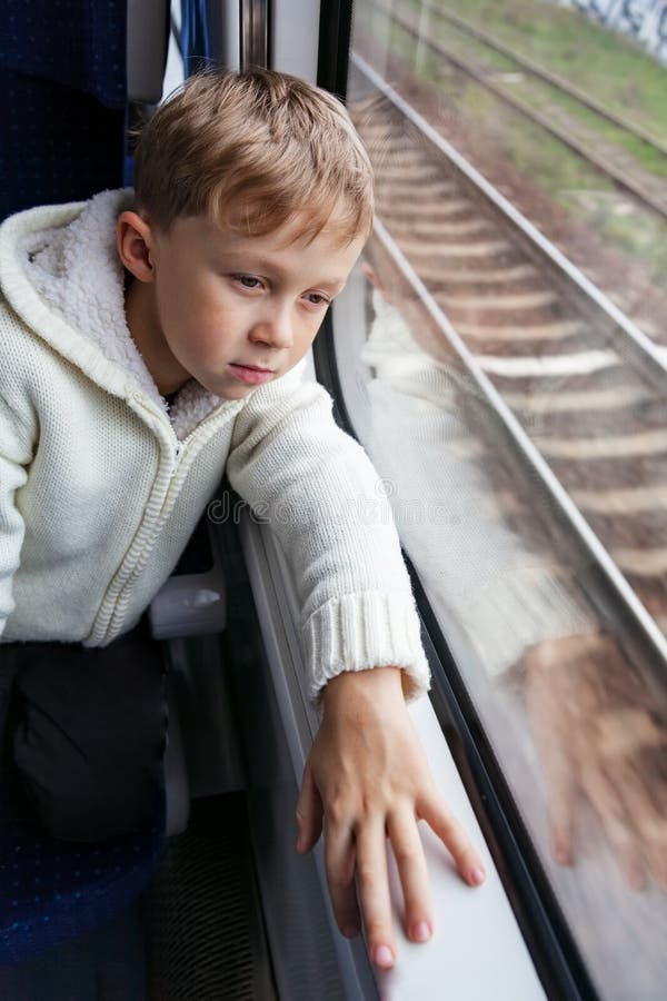 Boy Looking Out Train Window Stock Photo - Image of outgoing, parting ...