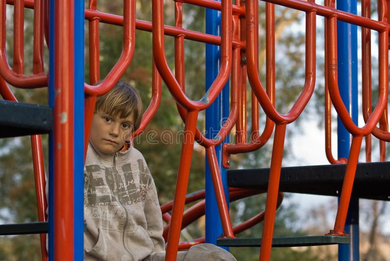 Sad boy in playground stock image. Image of playground - 3227243