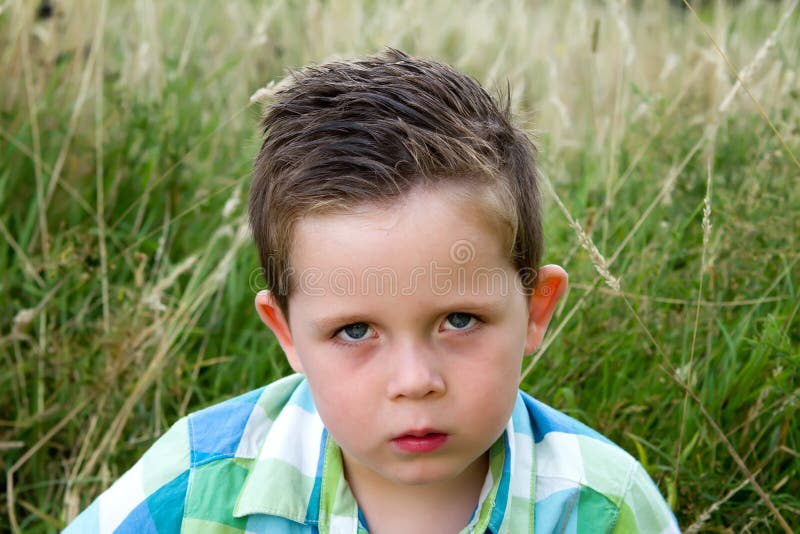 Sad Boy Scowling Whilst Looking Ahead Stock Image - Image of pressure ...