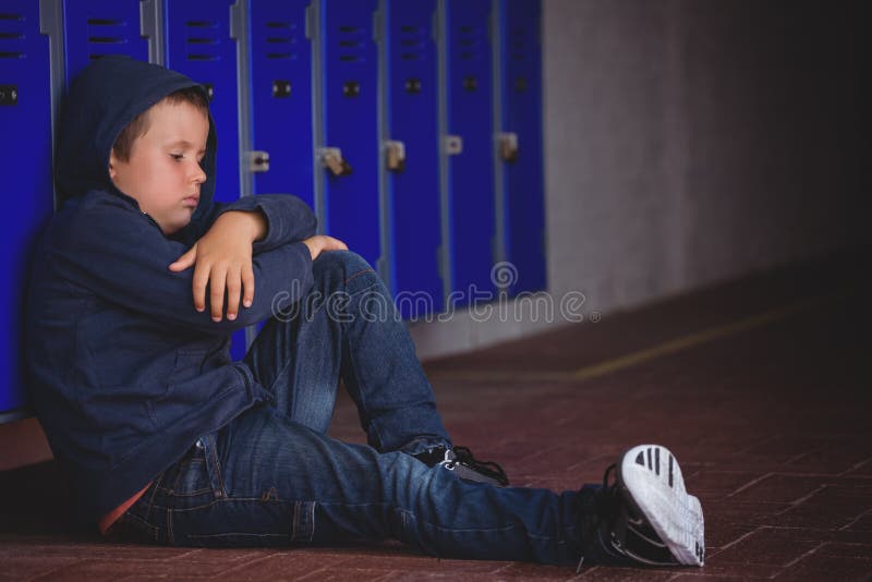 Sad Boy Sitting on Pavement by Lockers Stock Image - Image of isolation ...