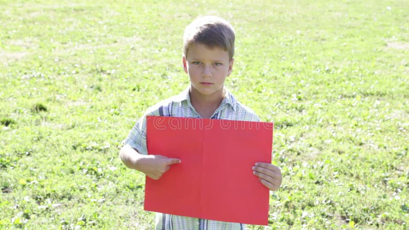 Sad Boy Standing with Empty Blank Banner Stock Footage - Video of board ...