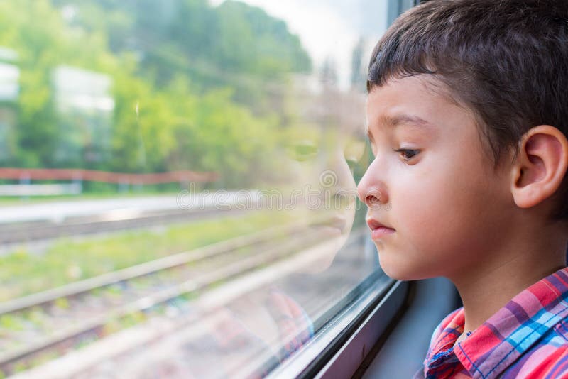 Sad boy on a train stock photo. Image of journey, looking - 123202772