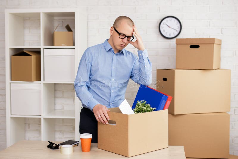 Sad Businessman Packing Things in Boxes for Moving Stock Image - Image ...