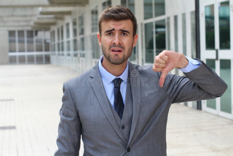 Sad Businessman Showing a Thumbs Down Stock Photo - Image of person ...