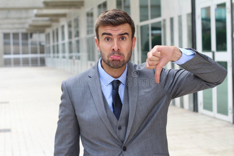 Sad Businessman Showing a Thumbs Down Stock Image - Image of finger ...