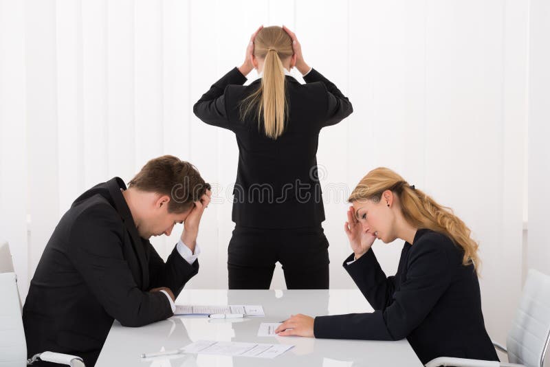 Sad Businesspeople in Office Stock Photo - Image of paper ...