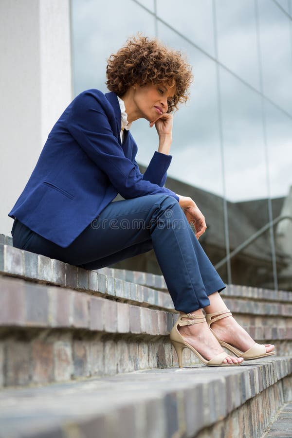 Sad Businesswoman Sitting in the Premises Stock Photo - Image of ...