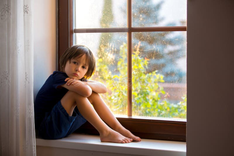 Sad Child Sitting on a Window on a Rainy Day Stock Photo - Image of ...