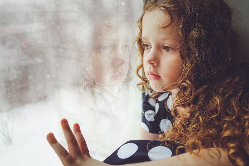 Sad Child Looking Out the Window. Toning Photo. Stock Photo - Image of ...
