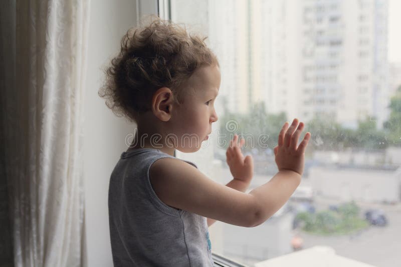 A Sad Child Looks Out the Window Stock Photo - Image of window, person ...
