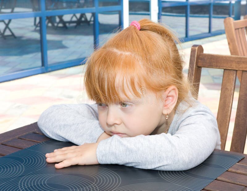 Sad Child Sitting at a Table Stock Image - Image of person, healthy ...
