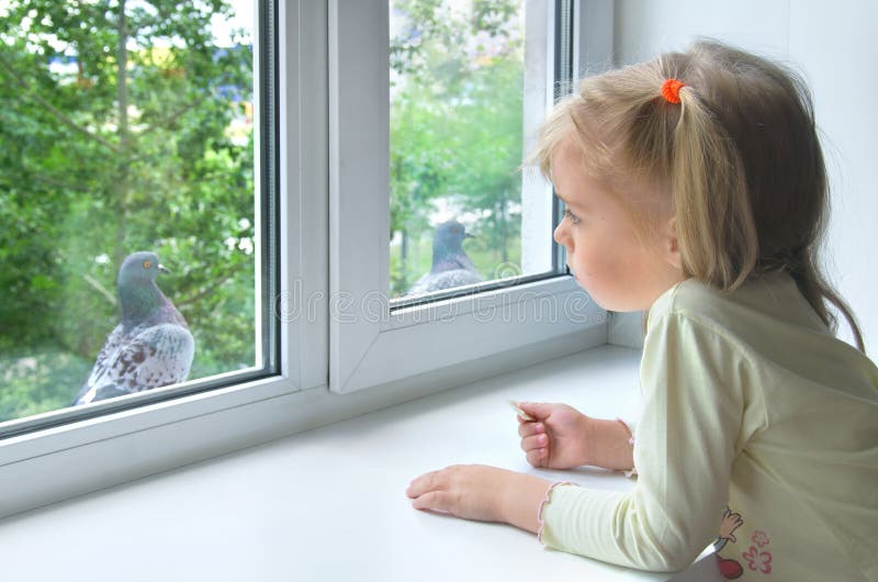 Sad child at the window stock photo. Image of russia - 20153068