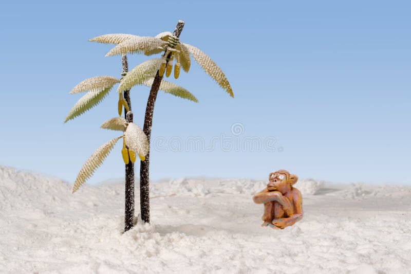 Sad Clay Monkey Sitting in the Snow Near the Snow-covered Palms Stock ...