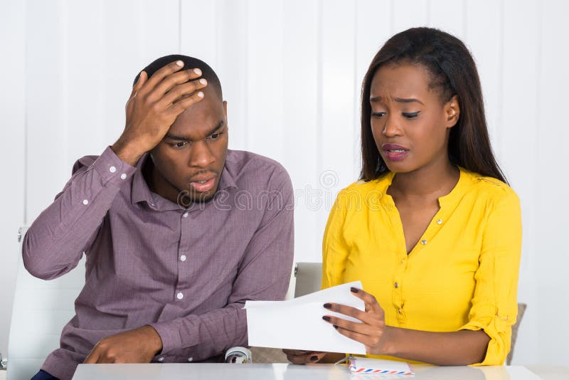 Sad Couple Looking at Bill stock image. Image of post - 74153963