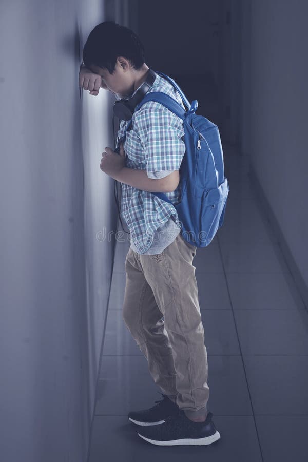 Sad and Depressed Young Boy at School Stock Photo - Image of concept ...