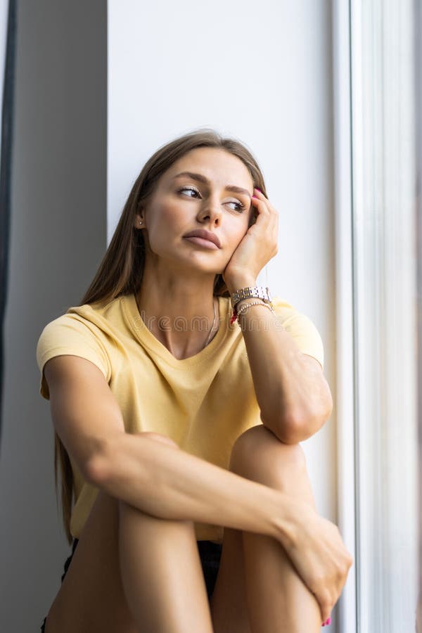 Sad Depressed Young Woman Having Social Problems Sitting on Windowsill ...