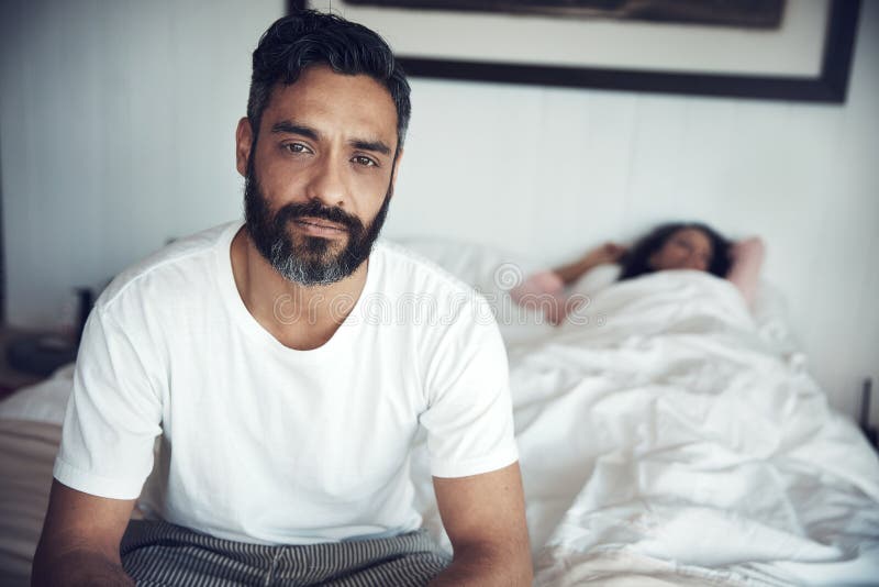 Sad Depression And Portrait Of A Man On A Bed With Wife Sleeping In