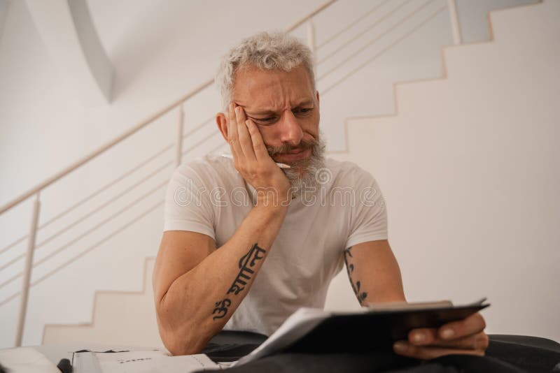 Sad Designer Looking at Clipboard in Stock Photo - Image of upset ...