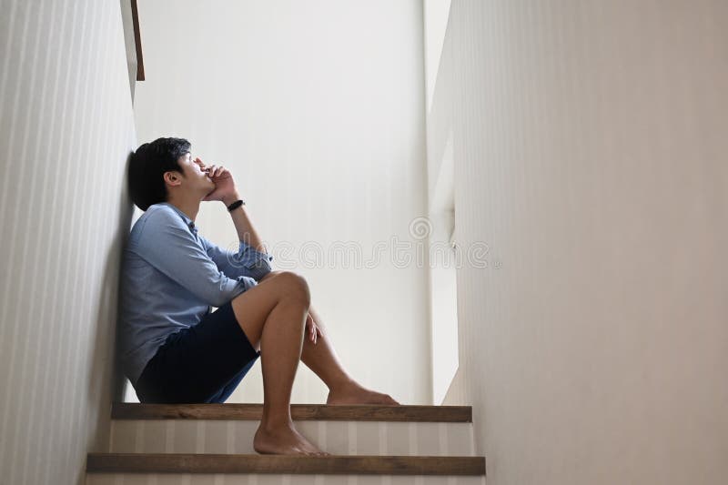 Sad and Desperate Man Suffering Depression Problem Sitting on Staircase ...