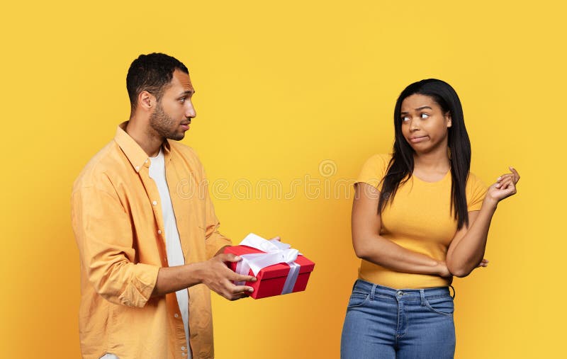 Sad Disappointed Millennial African American Guy Giving Box To