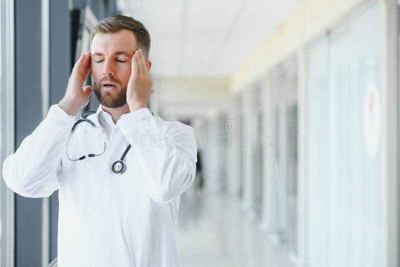 Sad Doctor Standing in Hospital Corridor Stock Image - Image of ...