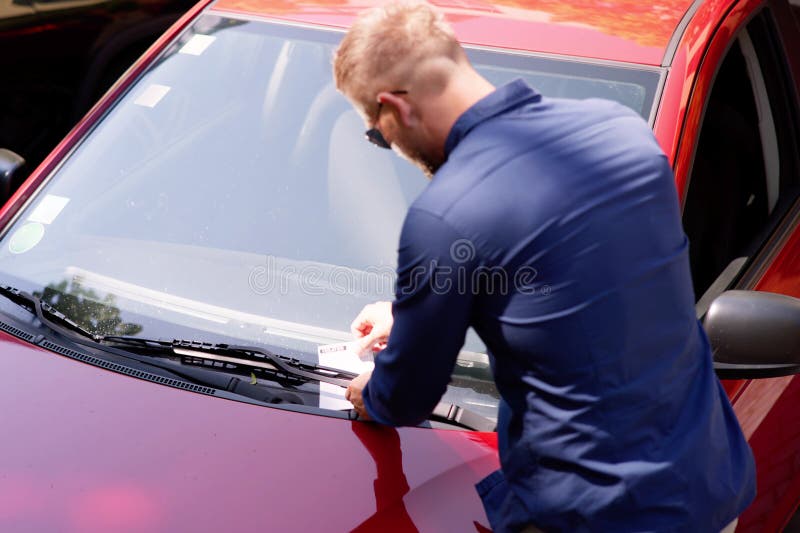 Sad Driver Looking at Parking Ticket on Car Stock Photo - Image of ...