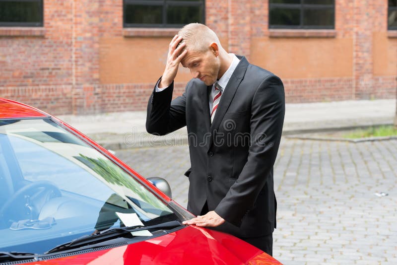 Sad Driver Looking at Parking Ticket on Car Stock Photo - Image of ...
