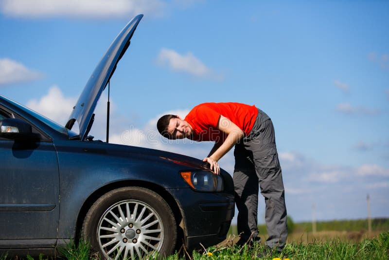 Sad driver near open hood stock photo. Image of danger - 93329980