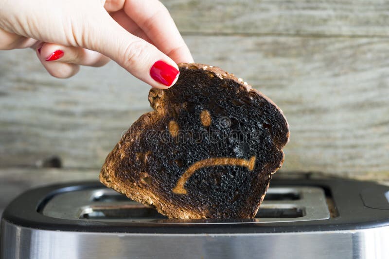 Sad Face on Slice of Burned Toast Bread Stock Image - Image of metallic ...